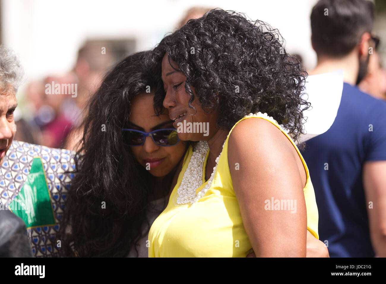 People grieving lost relatives outside Grenfell Tower fire disaster ...