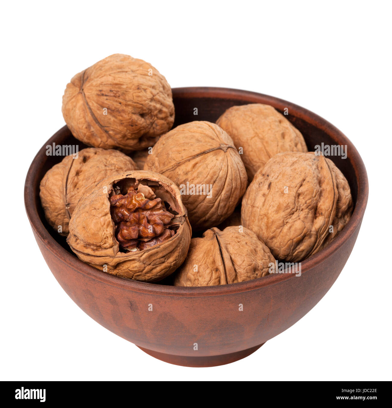 Walnuts in ceramic bowl isolated on white background Stock Photo - Alamy