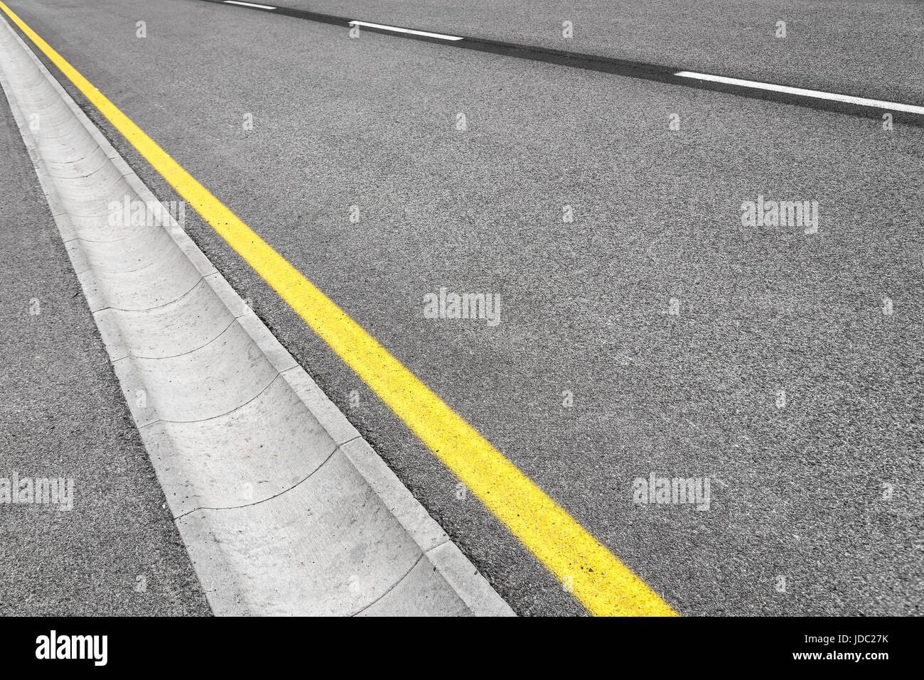 Drain concrete channel on the asphalt road Stock Photo - Alamy