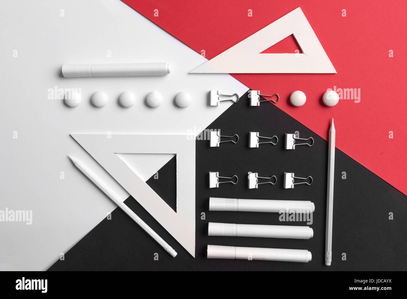 Image of office supplies on the white red and black background table ...