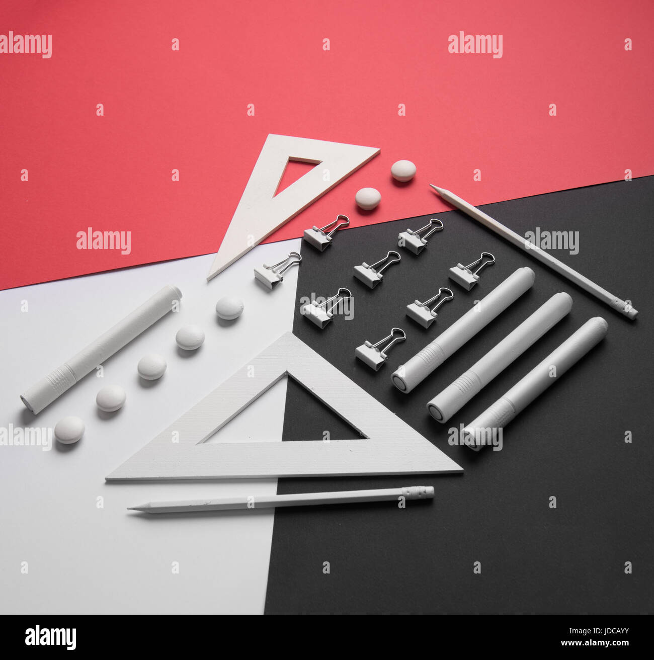 Image of office supplies on the white red and black background table ...