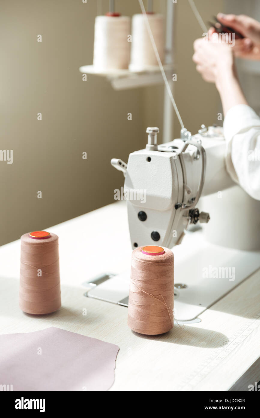 Woman using industrial sewing machine hi-res stock photography and ...