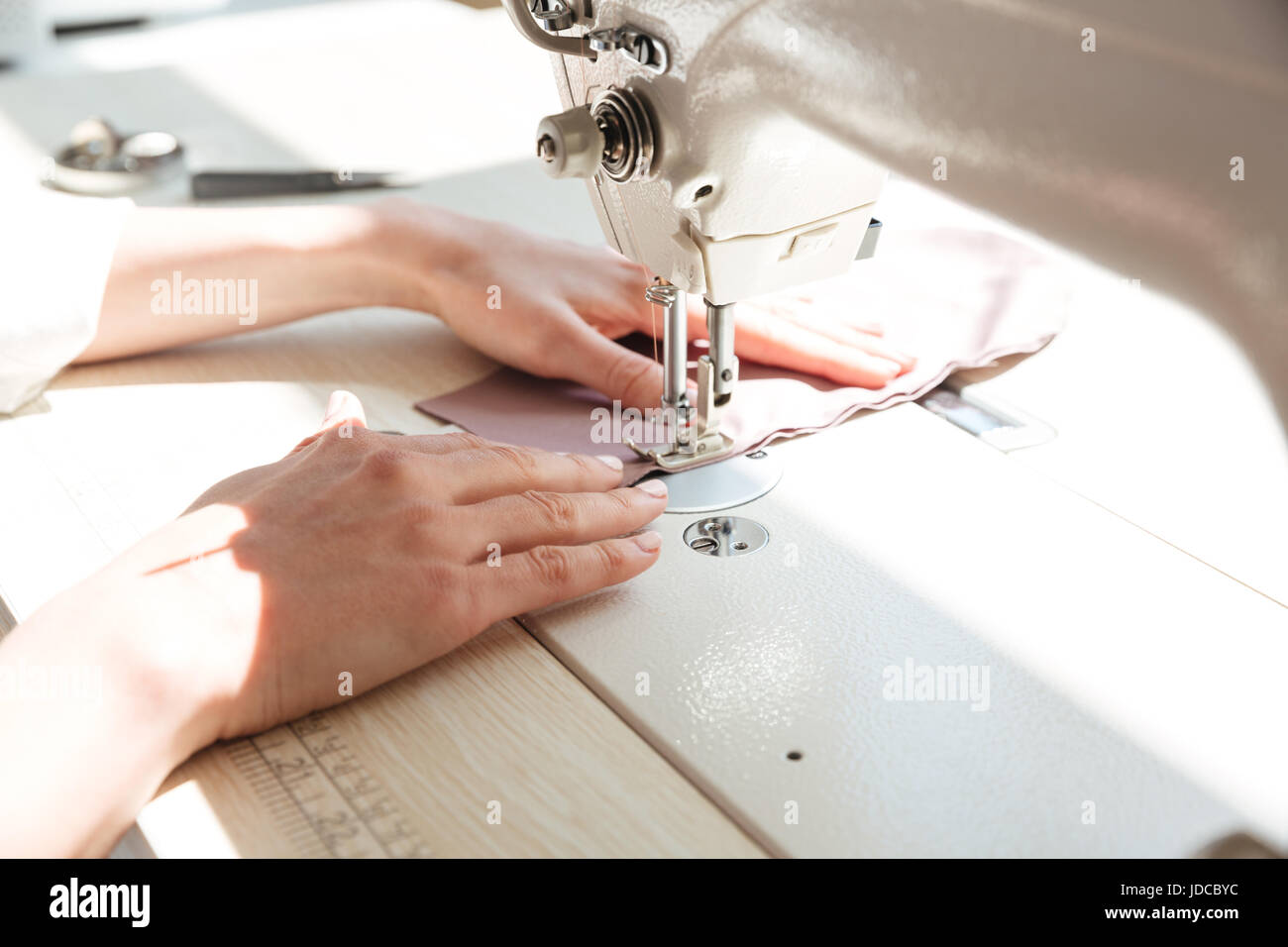 Woman using industrial sewing machine hi-res stock photography and ...