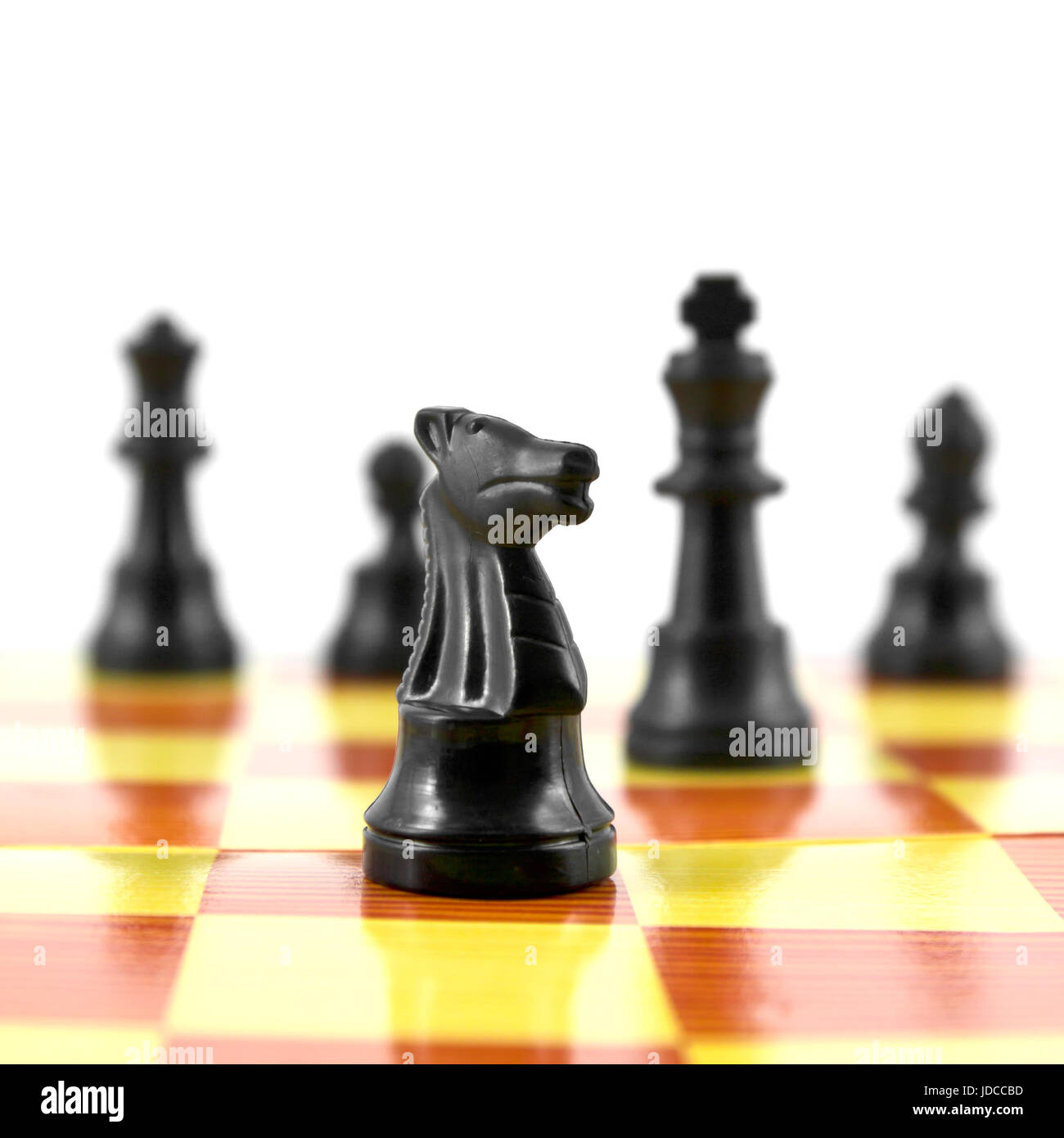 black knight on chess board isolated on white background Stock Photo ...