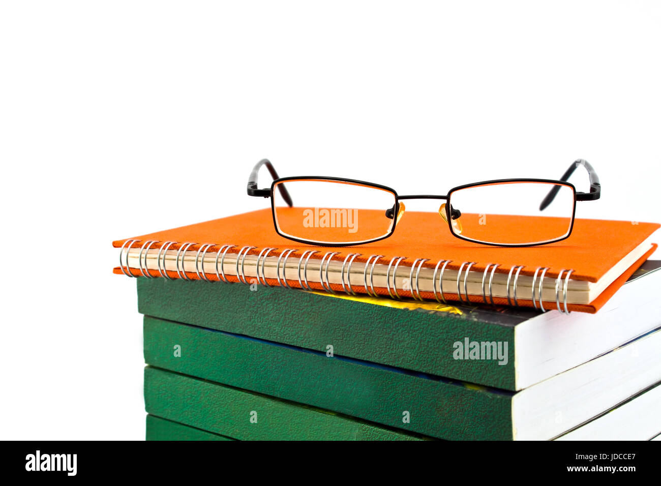 Orange notebook and eyeglasses isolated on white background Stock Photo ...
