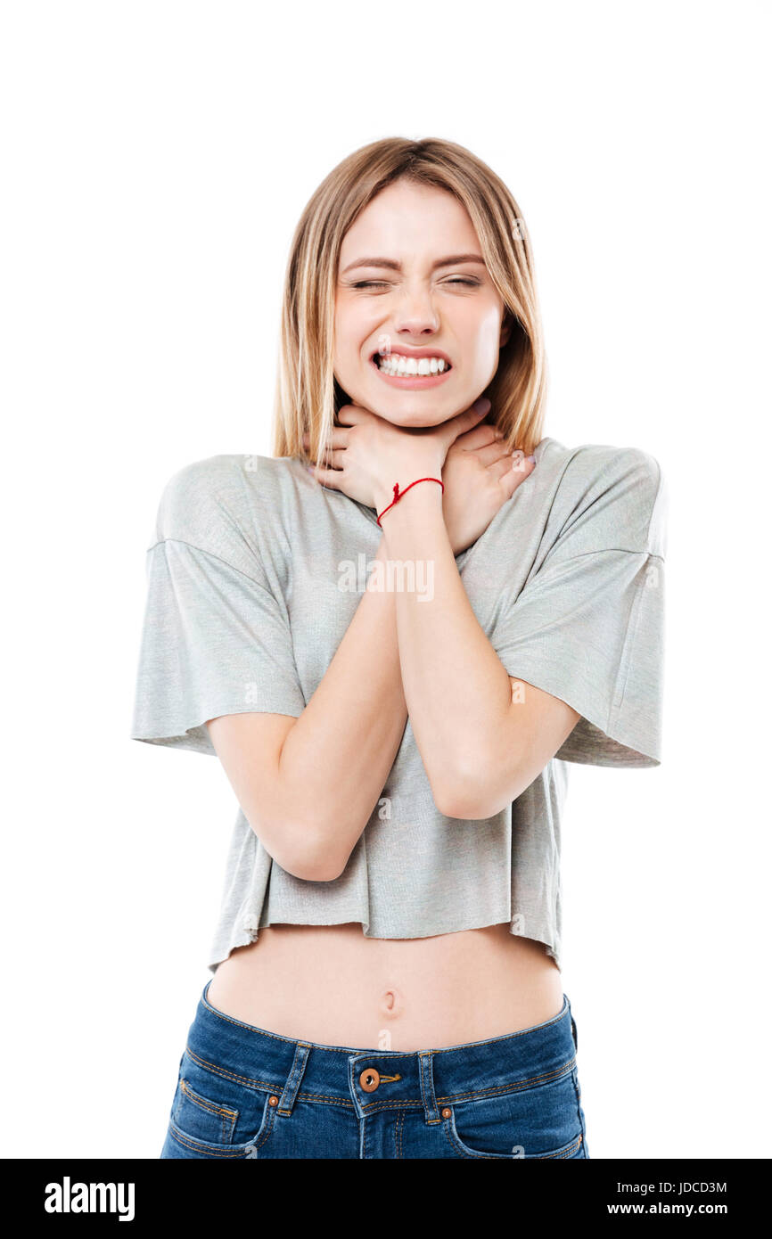 Picture of confused young lady standing isolated over white background ...