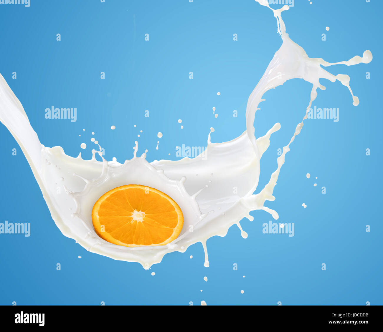 orange splash in milk Stock Photo - Alamy