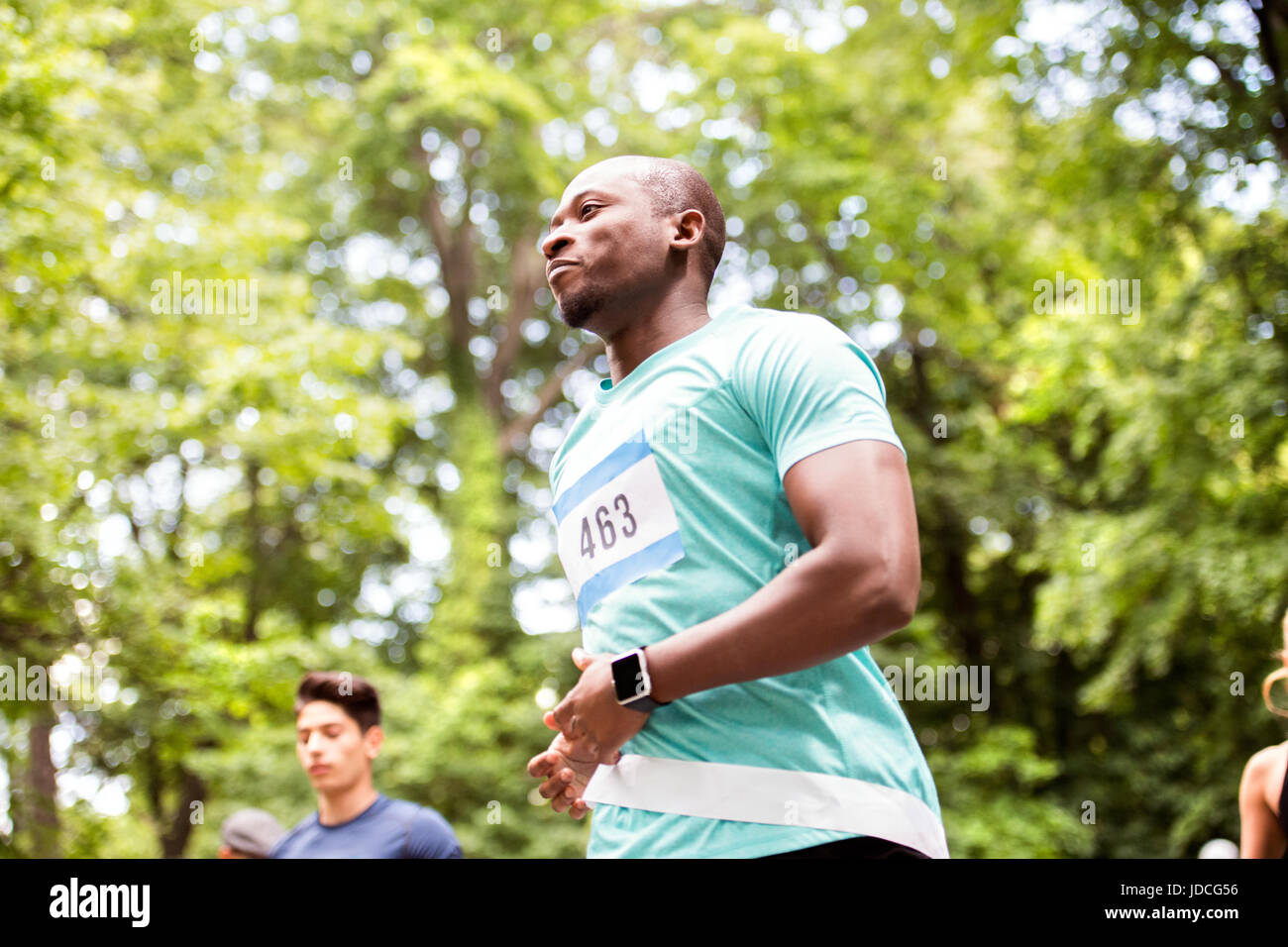 Young fit afro-american man crossing the finish line Stock Photo - Alamy