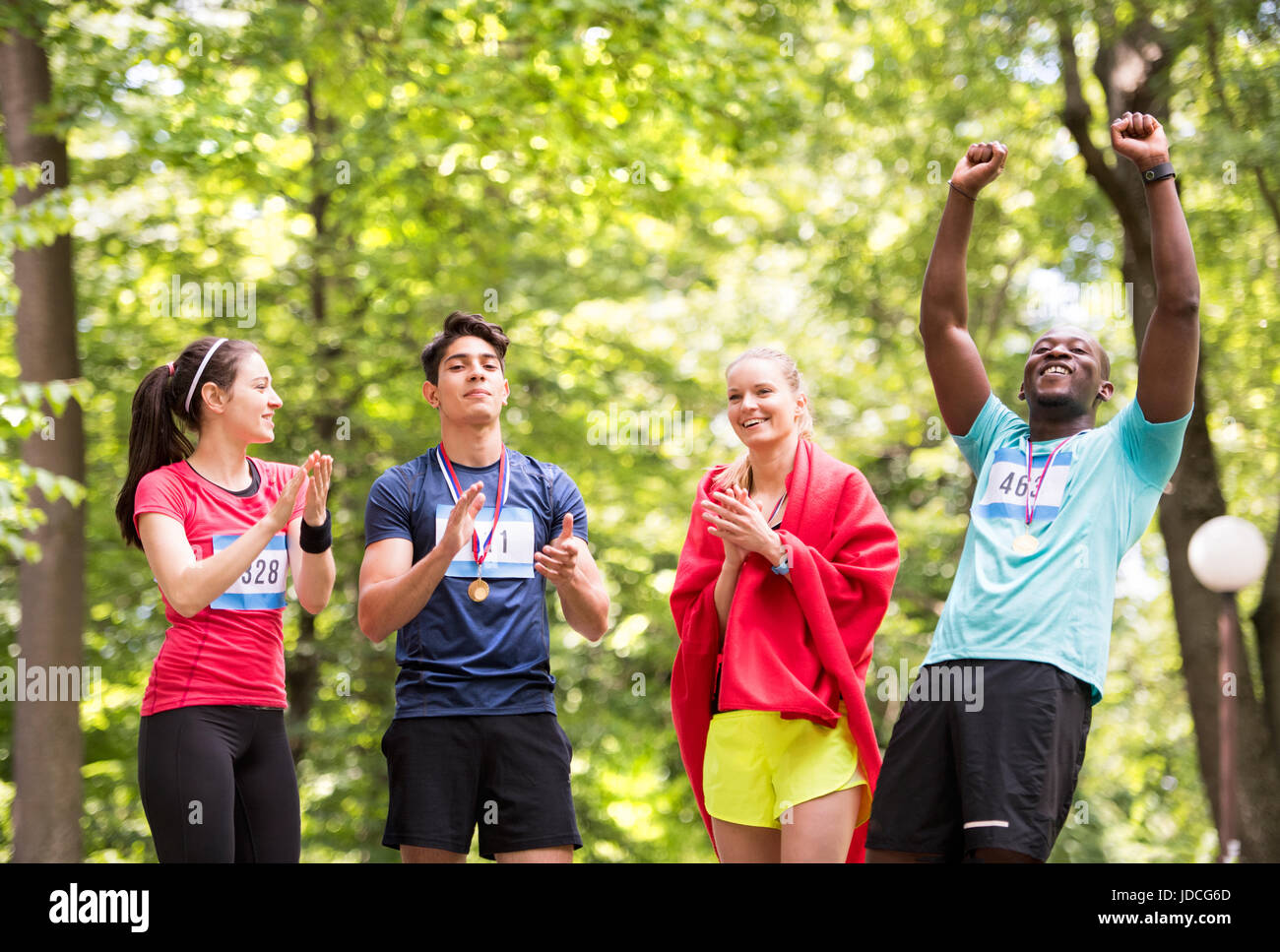Group of young fit friends happy after finishing race Stock Photo - Alamy