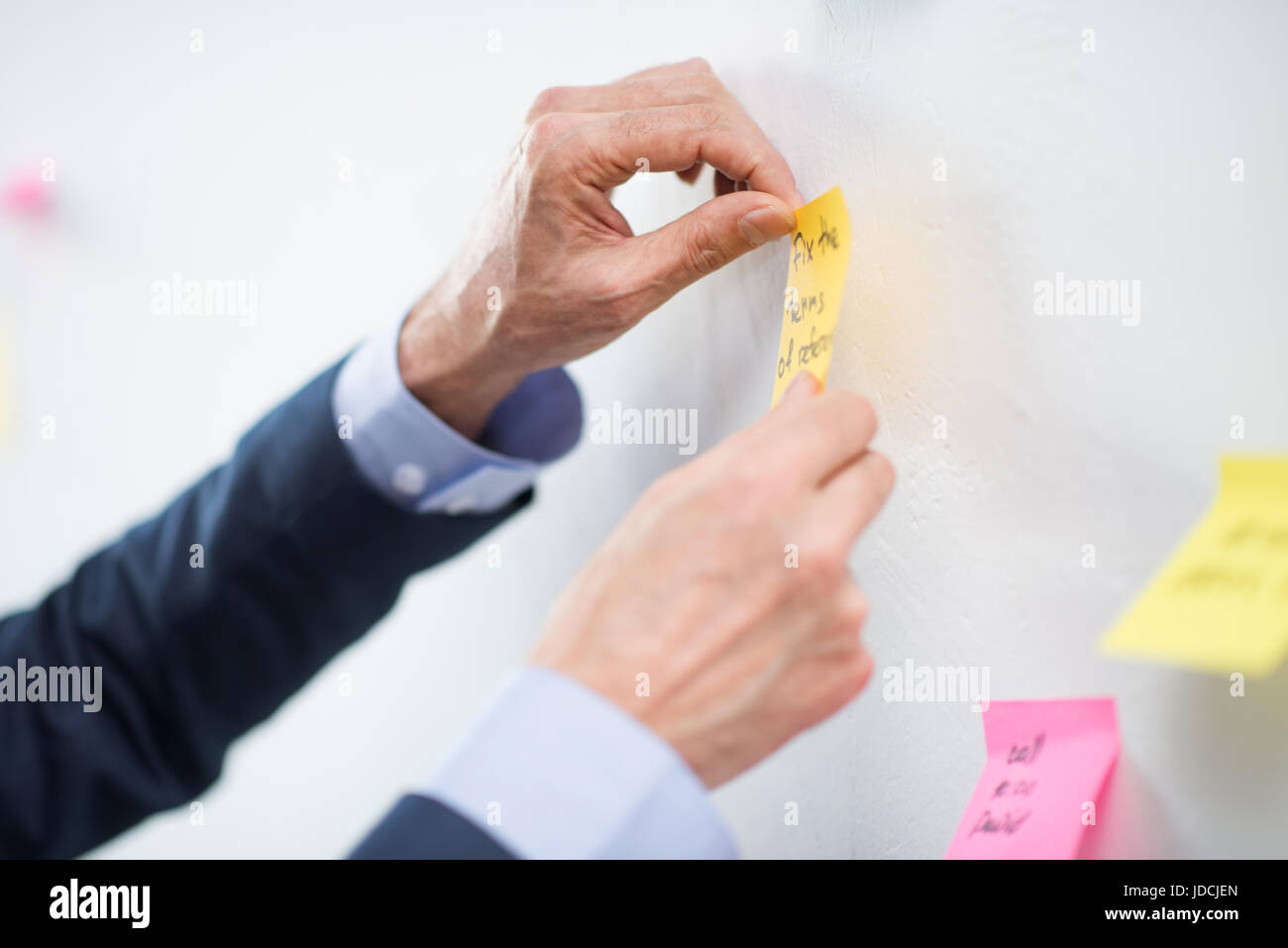 Partial view man putting sticker hi-res stock photography and images ...