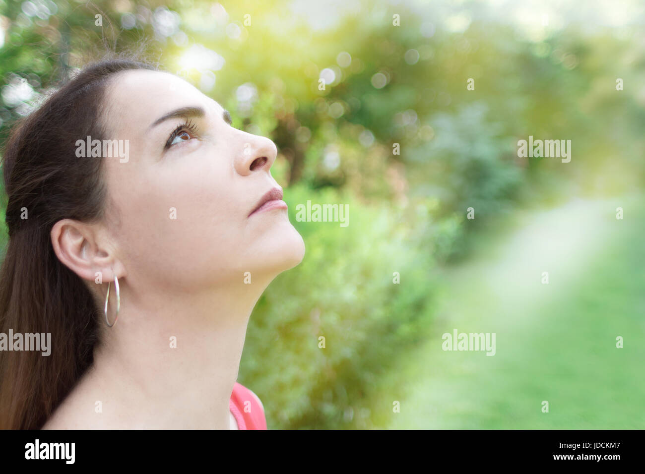 Woman Looking Up At Sky