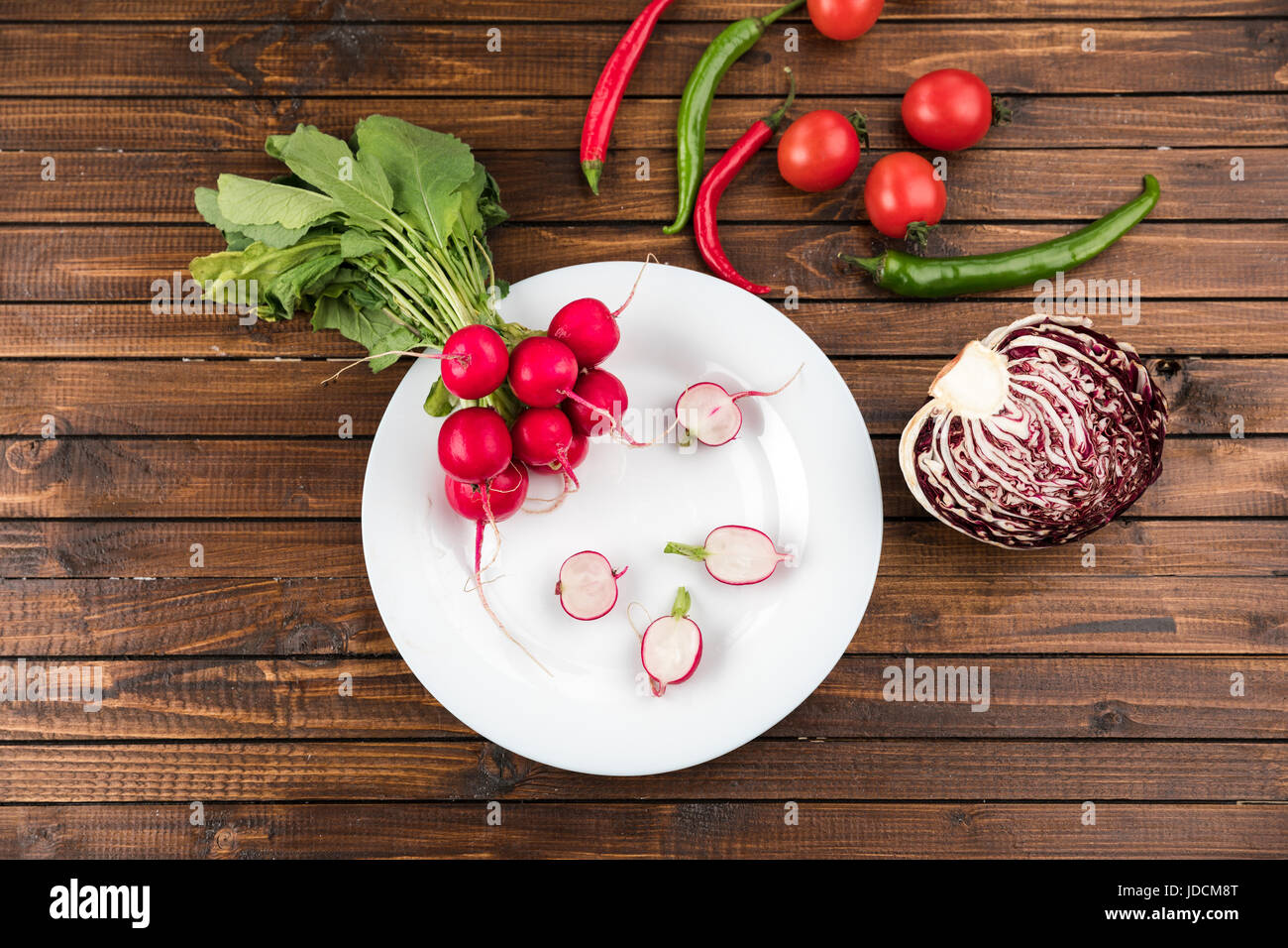 different fresh seasonal vegetables on wooden table top texture Stock ...