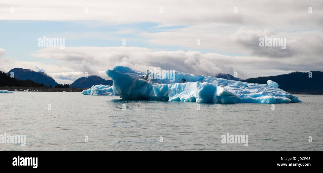 Glacier ice takes on a blue color in the sunshine Stock Photo - Alamy