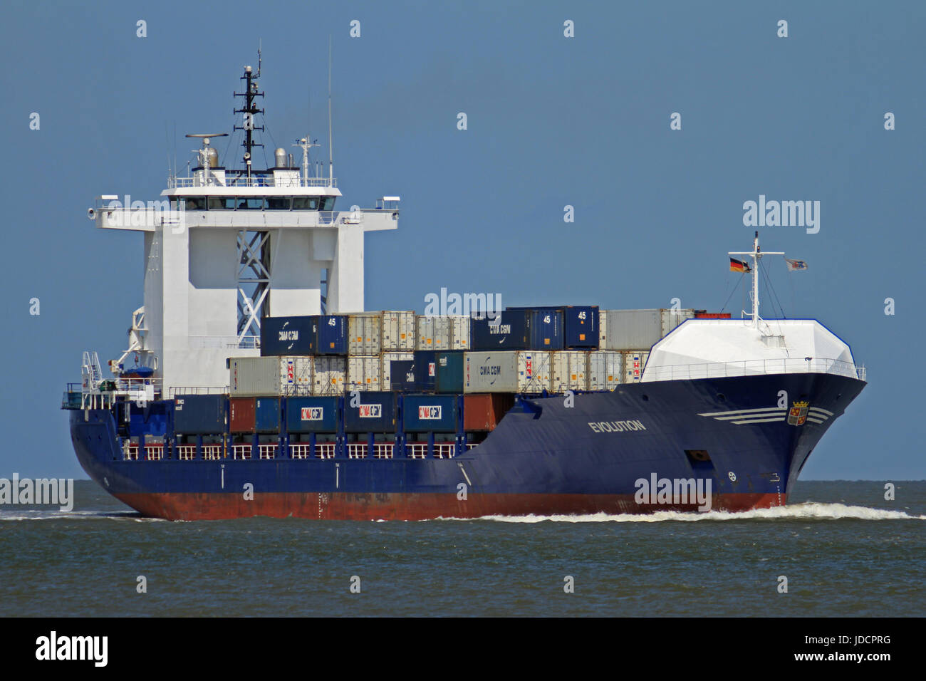 The container ship Evoulution on the Elbe river passing Cuxhaven on the ...
