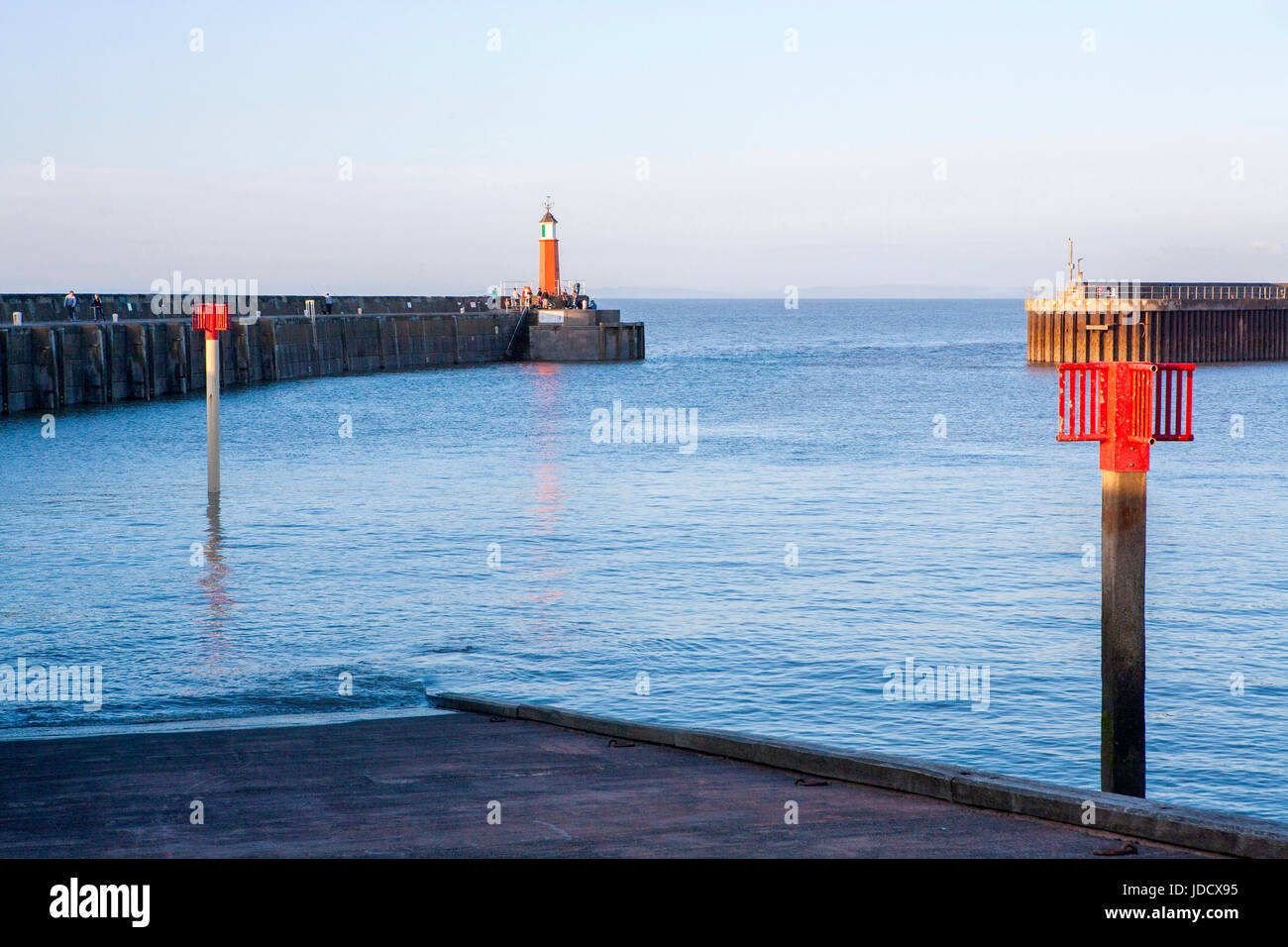 Watchet Harbour and Red lighthouse. The harbour entrance at Watchet on ...