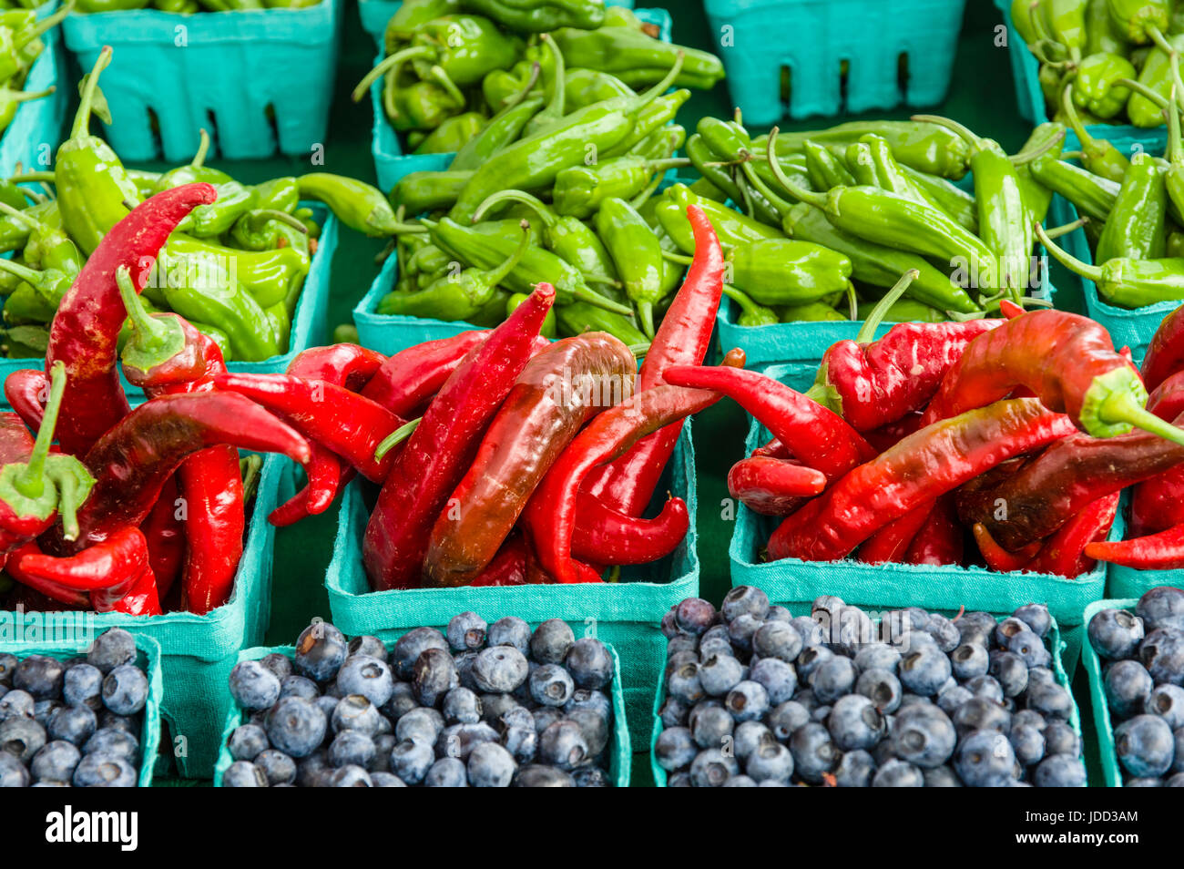 Boxes of red and green hot peppers at the farm market Stock Photo - Alamy