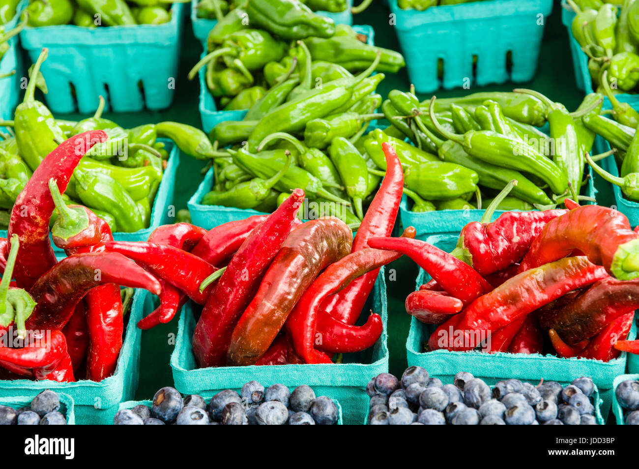 Boxes of red and green hot peppers at the farm market Stock Photo - Alamy