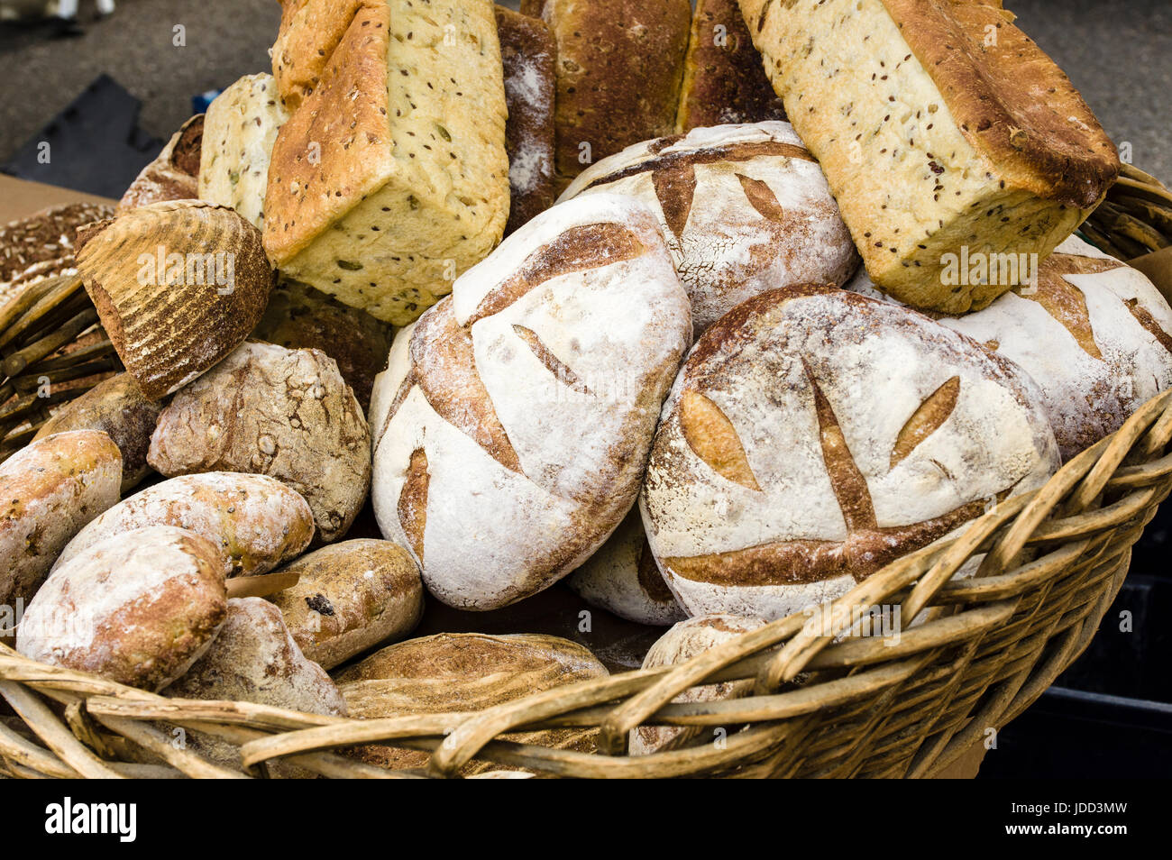 Loaves of fresh baked bread on display at the market Stock Photo - Alamy