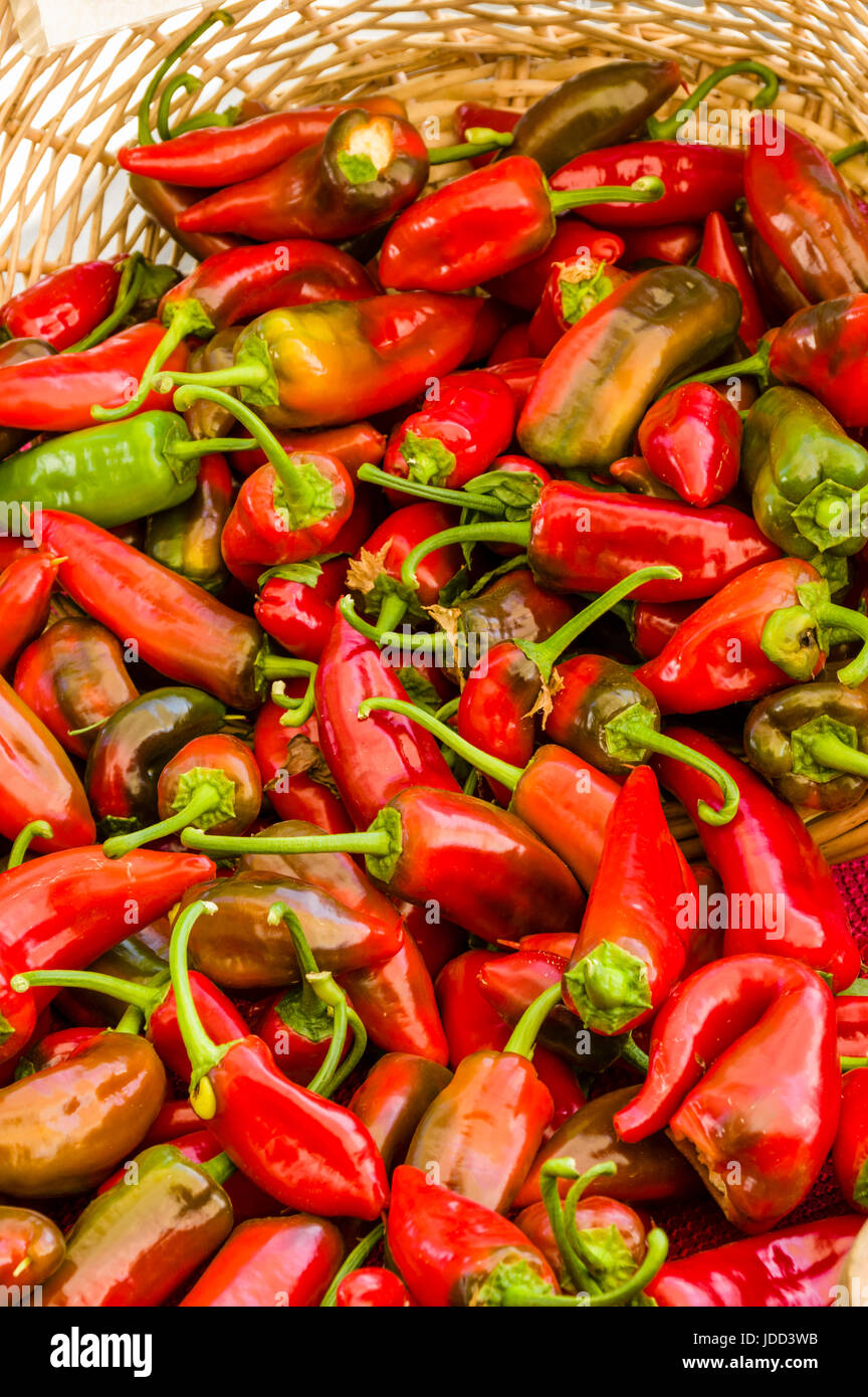 Red hot peppers in a wicker basket display at that market Stock Photo ...