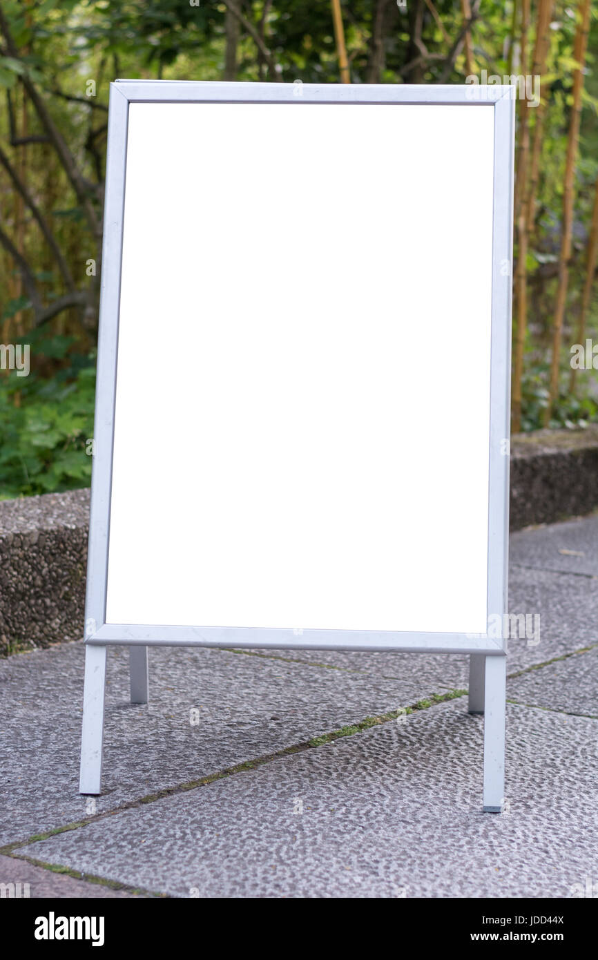 Blank ad space sign infront of trees in a park on the ground Stock ...