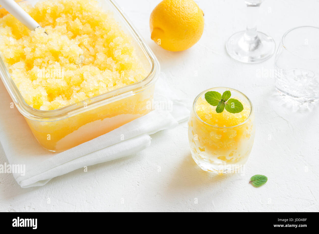 Lemon Frozen Granita Slush Drink on white table. Homemade Italian ...
