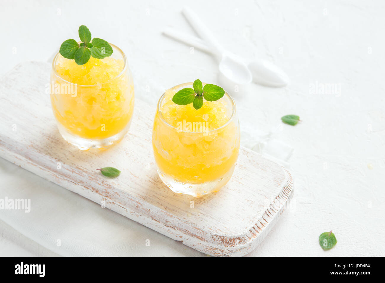 Lemon Frozen Granita Slush Drink on white table. Homemade Italian ...