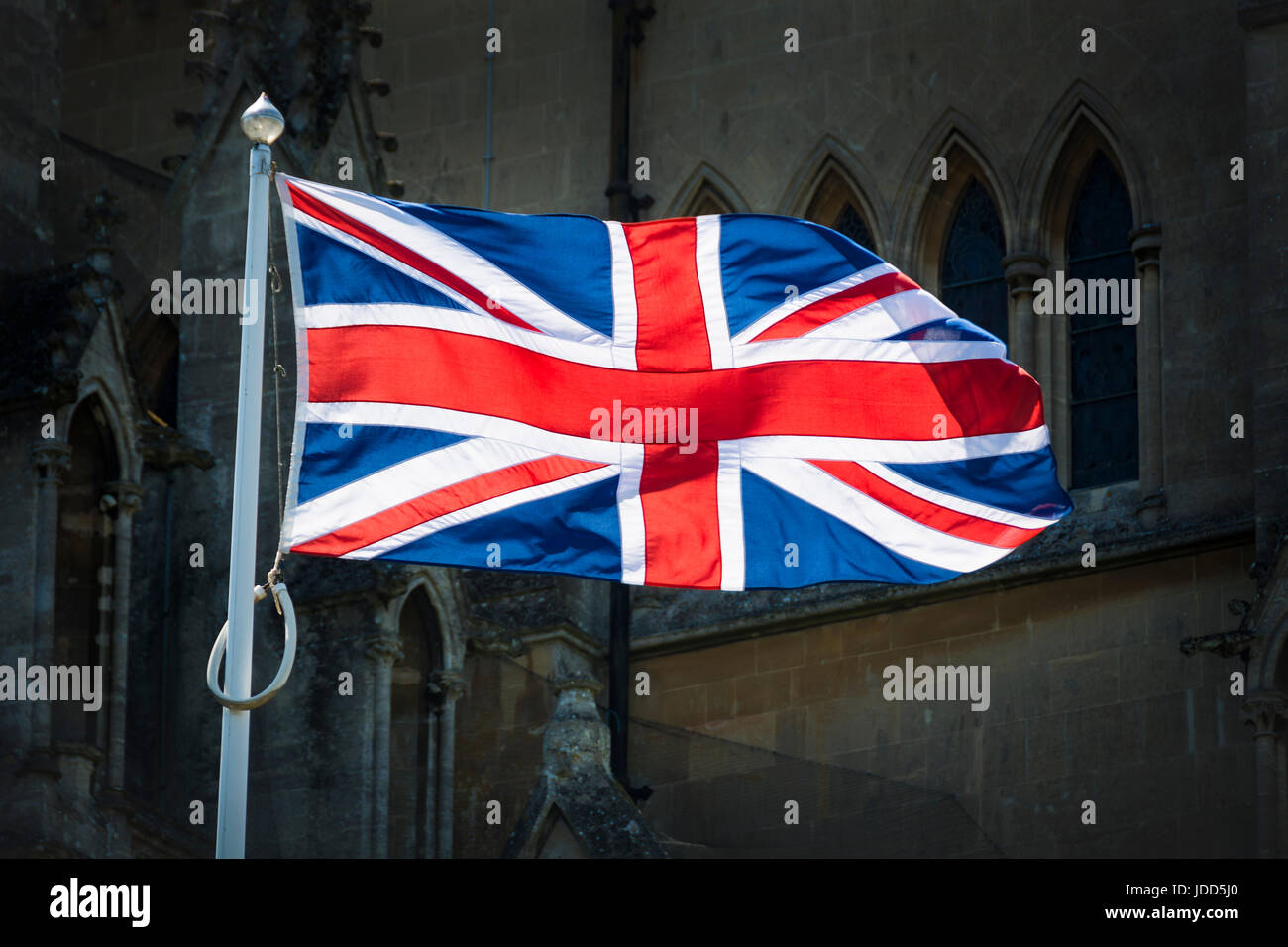 Union Jack in sunlight against cathedral background Stock Photo - Alamy