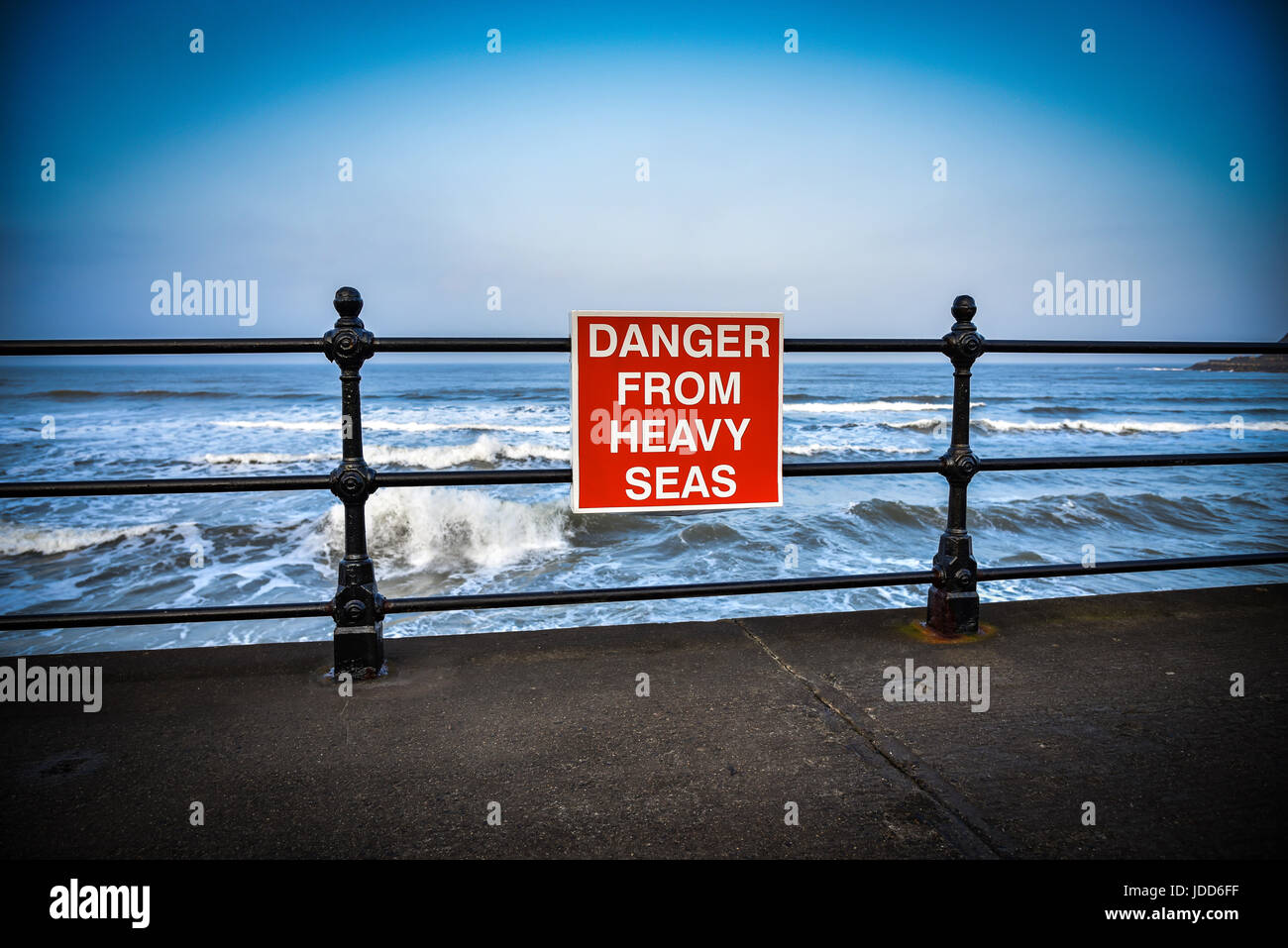 Danger from heavy seas sign on the beach at the English east coast ...