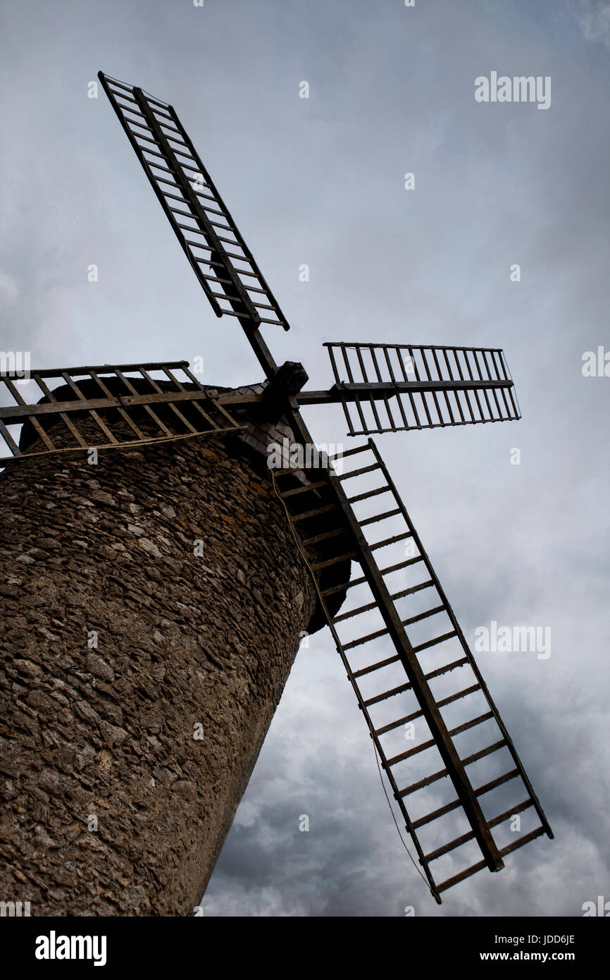 Old mill and cloudy sky in background Stock Photo - Alamy