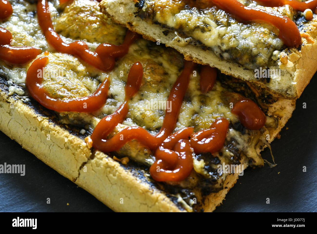 Cheese covered sandwich straight from the oven Stock Photo - Alamy