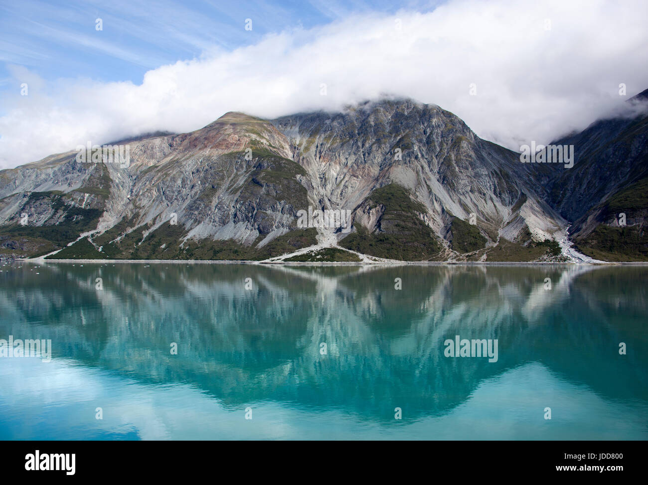 The mountain range and it's reflections in Glacier Bay national park ...