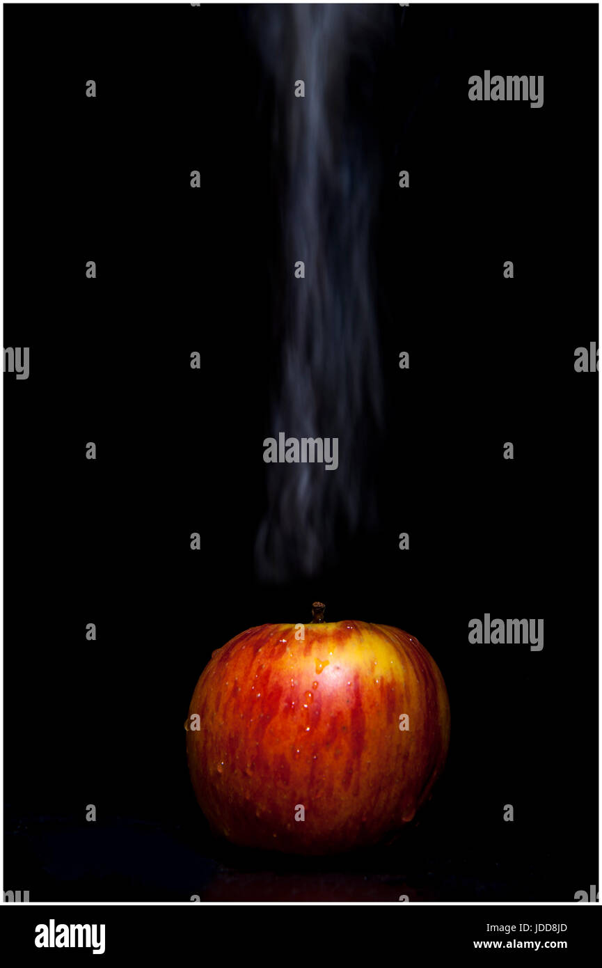 An apple with smoke coming off it Stock Photo - Alamy
