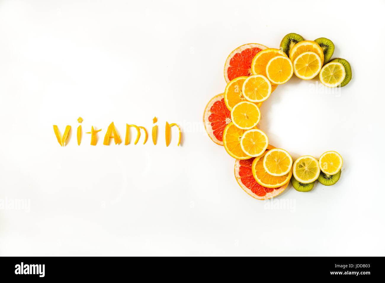 Vitamin C letters made of citrus fruits - lemon, grapefruit, kiwi and ...