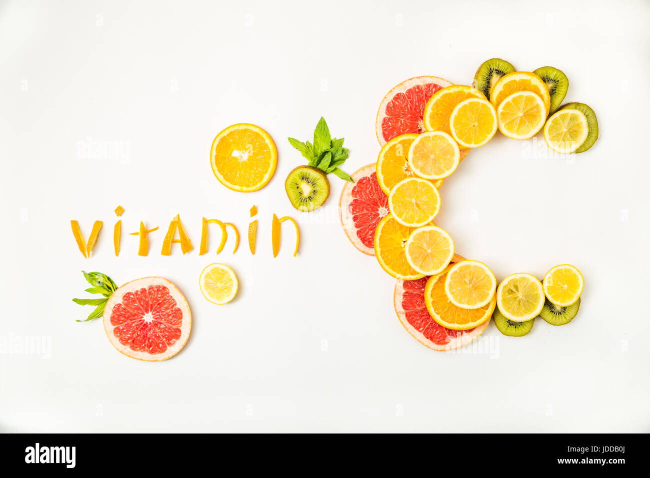 Vitamin C letters made of citrus fruits - lemon, grapefruit, kiwi and ...