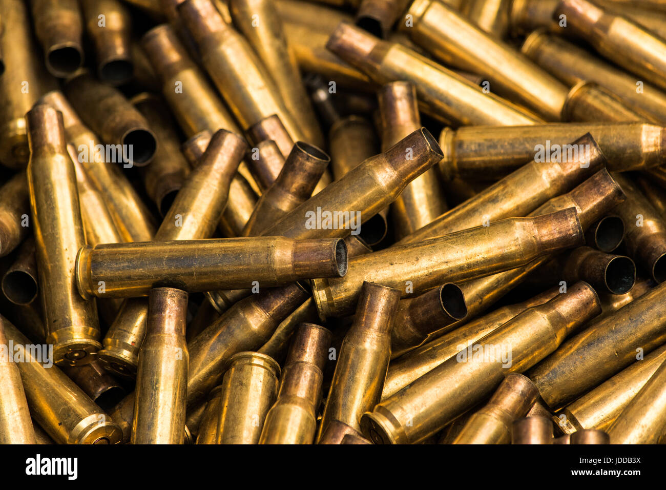 Empty rifle shells on pile Stock Photo - Alamy