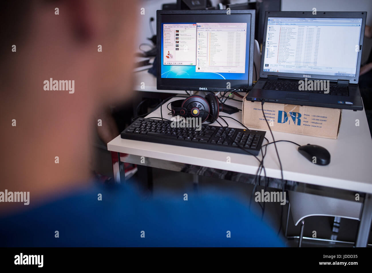 An inmate sits in front of computers in Heidering prison in Grossbeeren ...