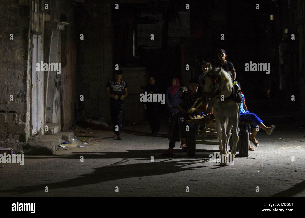 Gaza City, The Gaza Strip, Palestine. 19th June, 2017. Palestinians ride a horse cart during ...