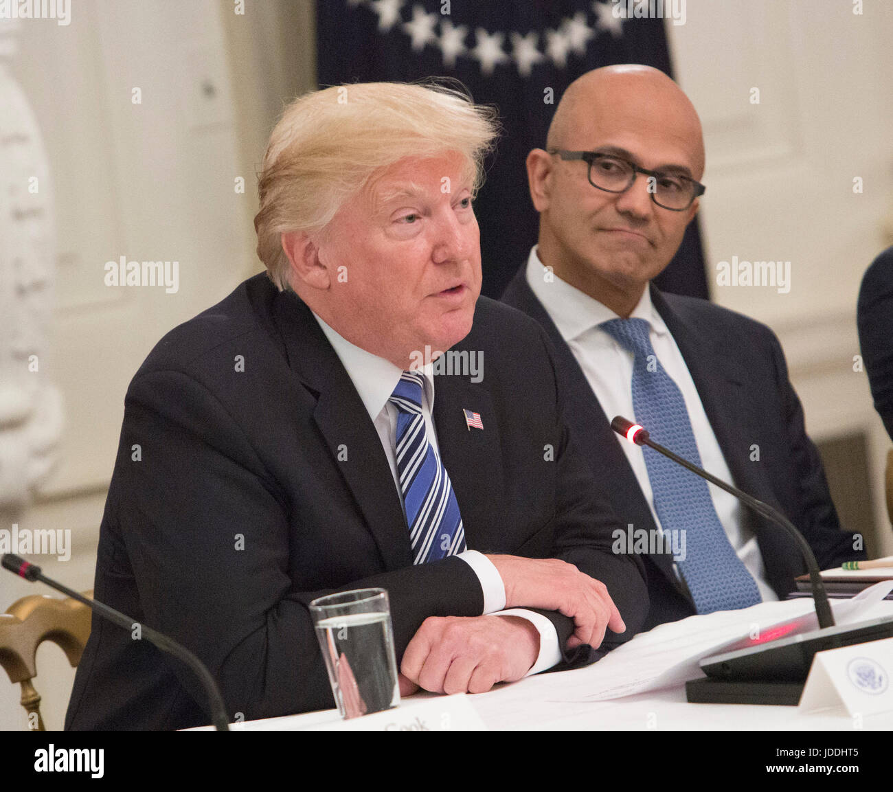 United States President Donald J. Trump (left) participates in an ...