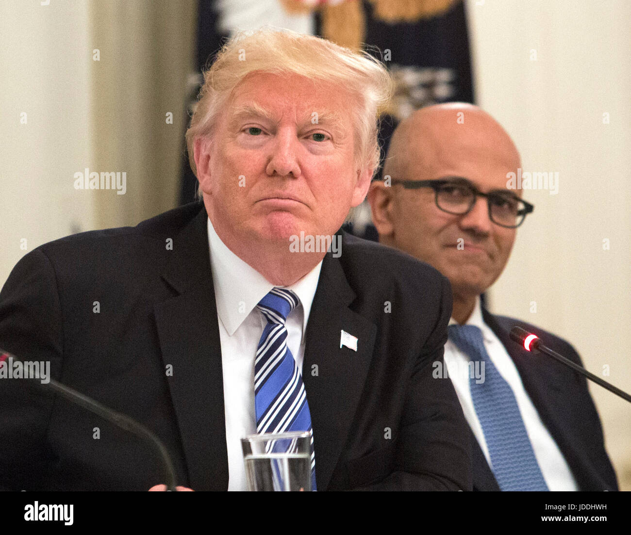 United States President Donald J. Trump (left) participates in an ...
