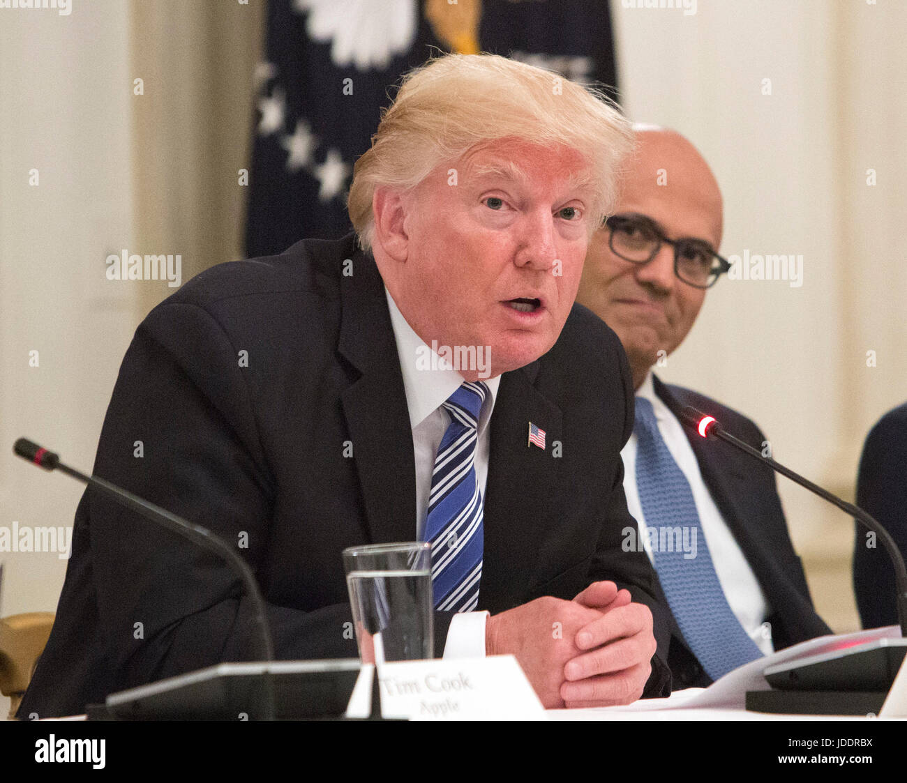 United States President Donald J. Trump (left) participates in an ...