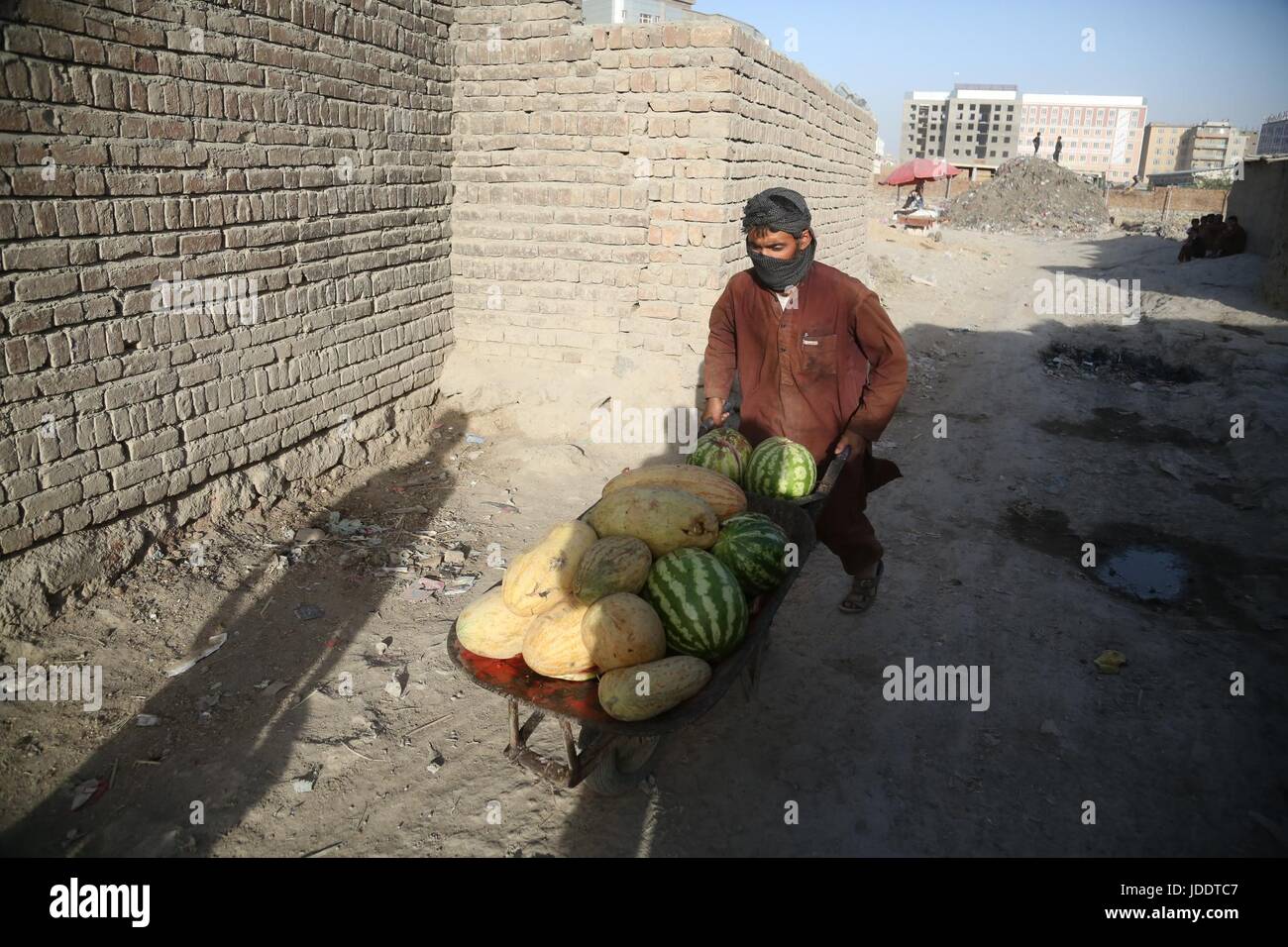 Kabul, Afghanistan. 20th Jun, 2017. An Afghan displaced man pushes a ...