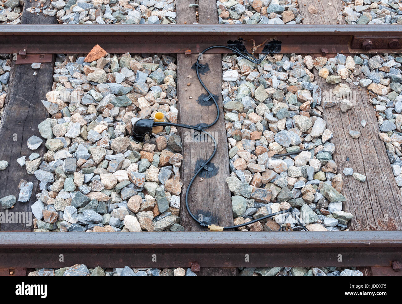 Electric wire from the black pipe for detect the train movement in the ...