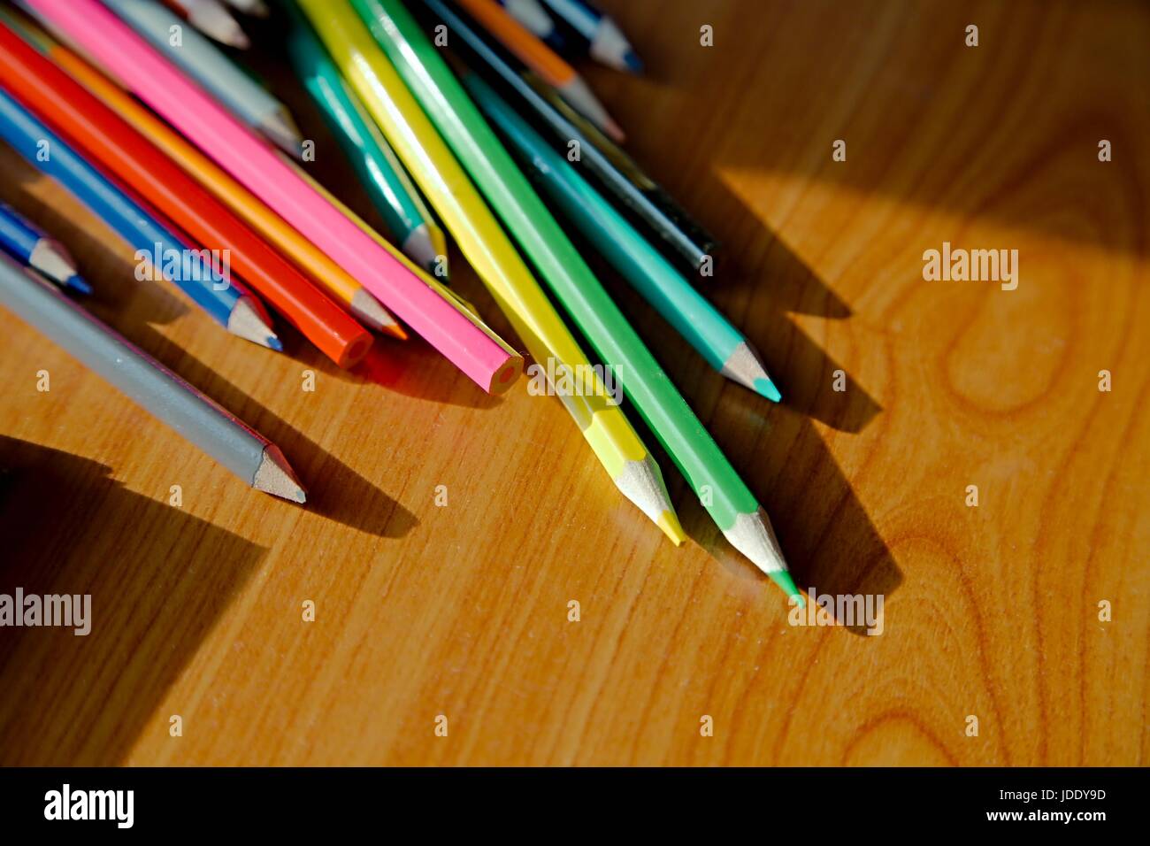 Many color pencils on the desk Stock Photo - Alamy