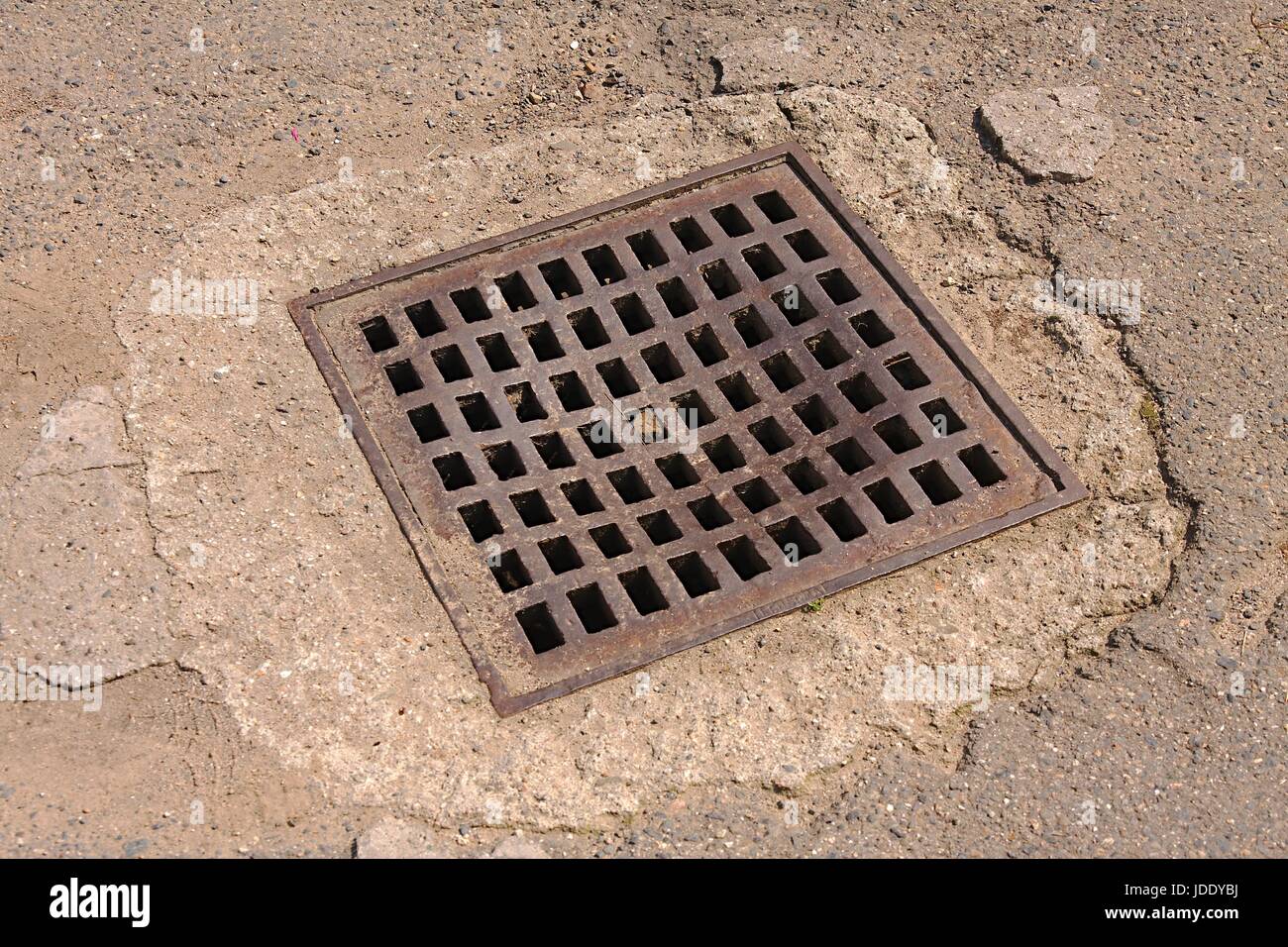 Sewer cover on a street Stock Photo - Alamy