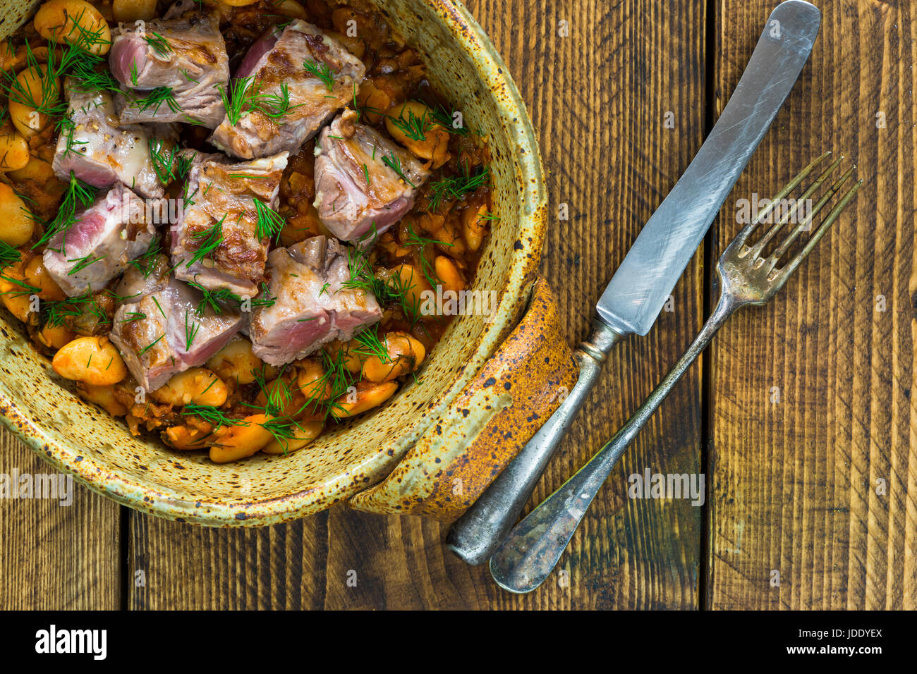 Seared lamb with beans - top view Stock Photo - Alamy