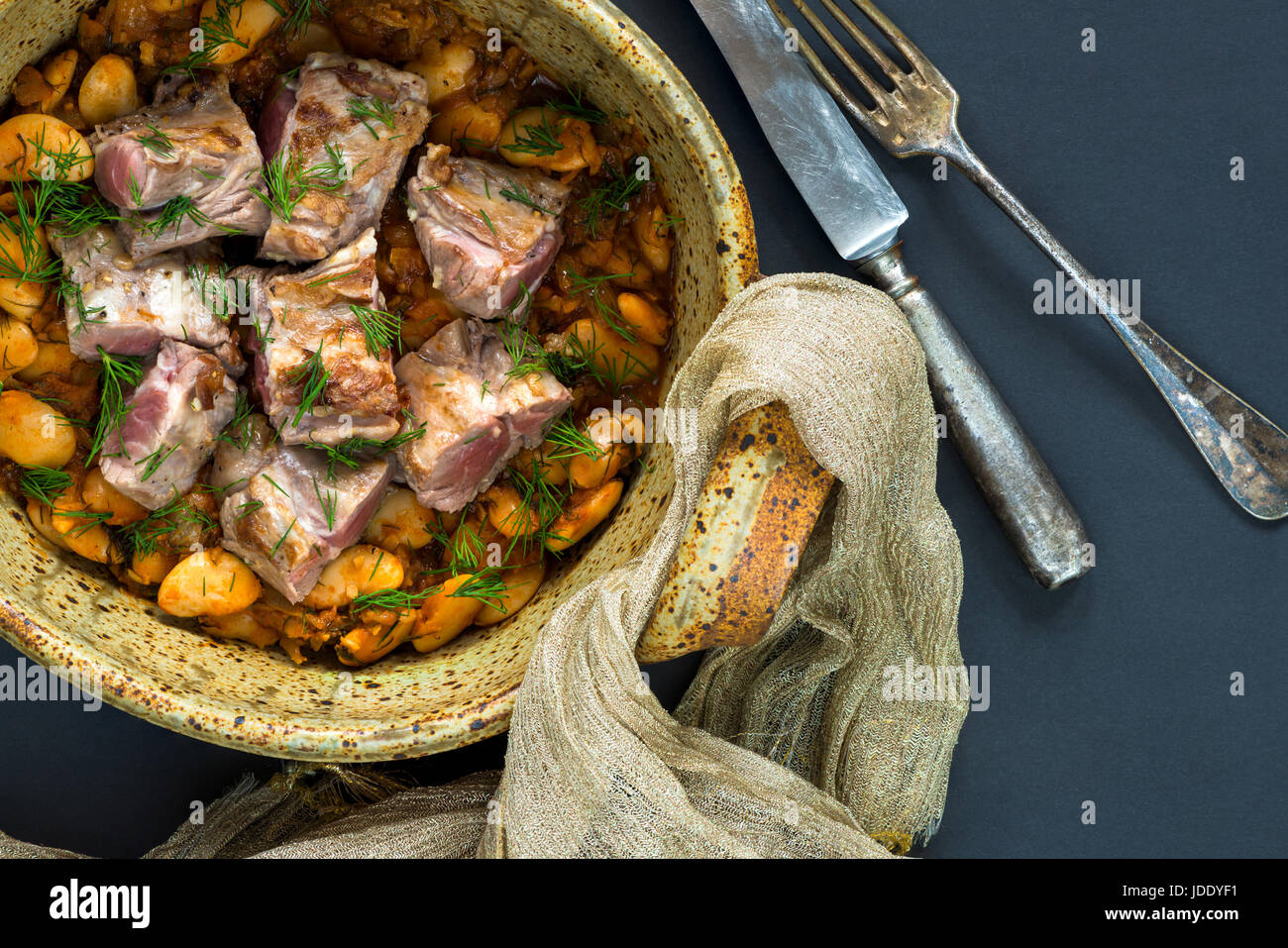 Seared lamb with beans - top view Stock Photo - Alamy