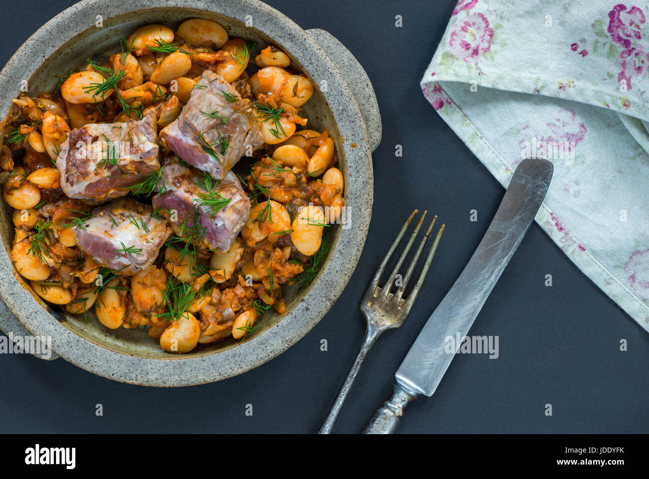 Seared lamb with beans - top view Stock Photo - Alamy