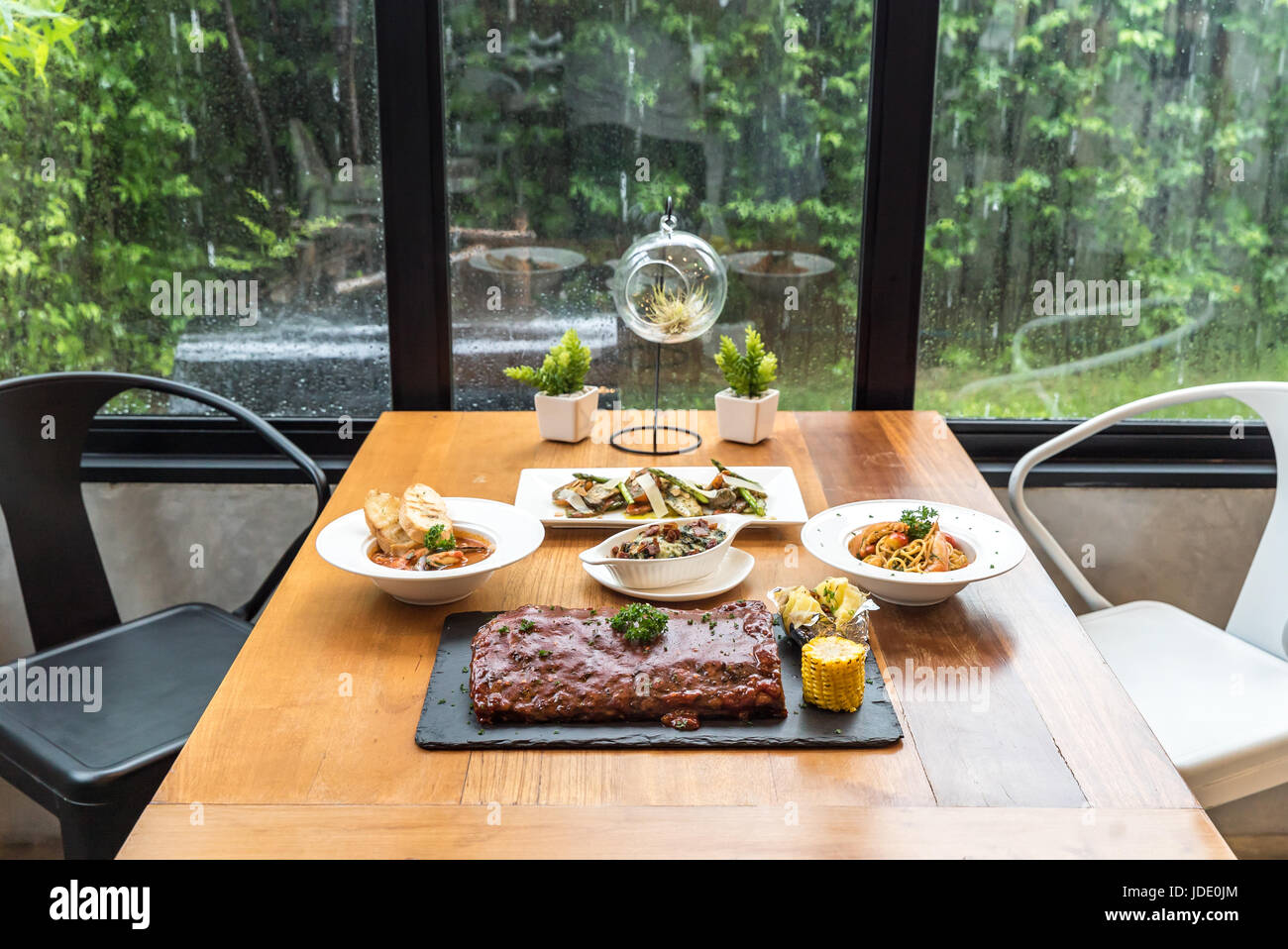 dining table with food ready to eat Stock Photo - Alamy