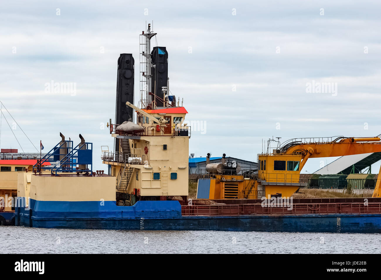Blue cargo ship loading in the port of Riga, Europe Stock Photo - Alamy