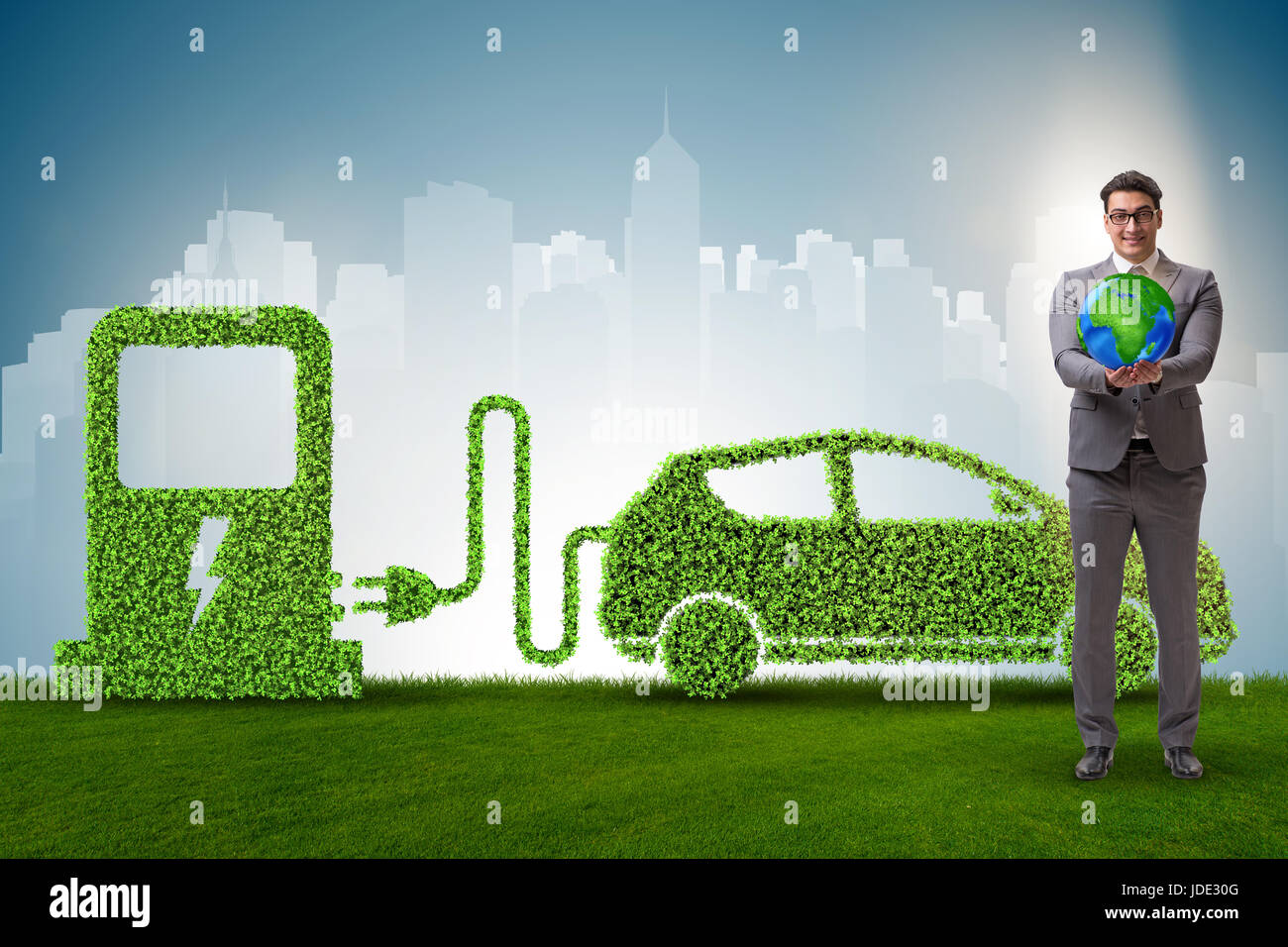 Electric car concept in green environment concept Stock Photo - Alamy
